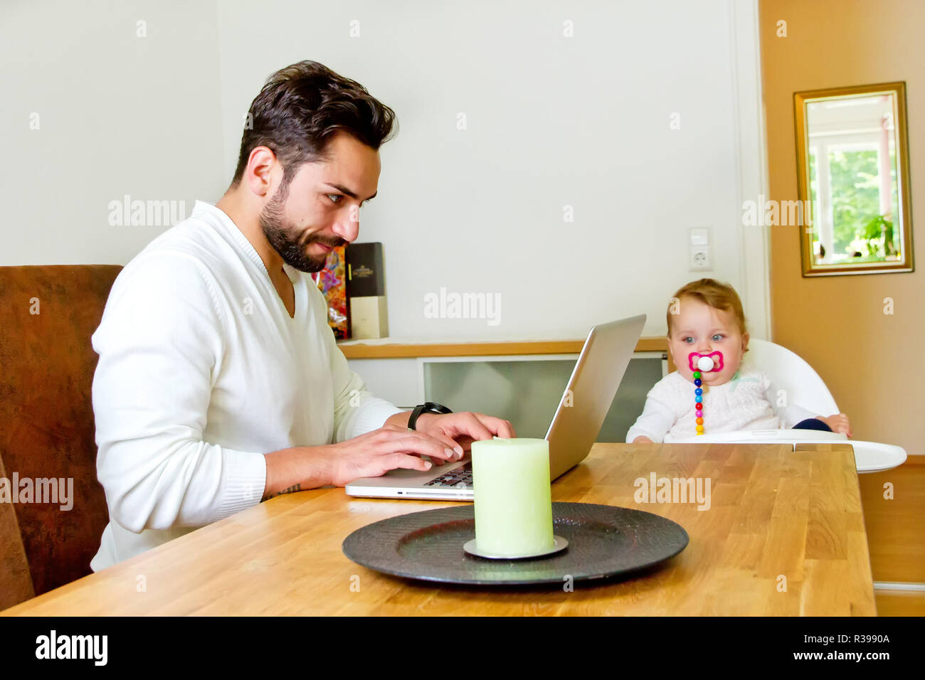 father works in the computer at home Stock Photo - Alamy