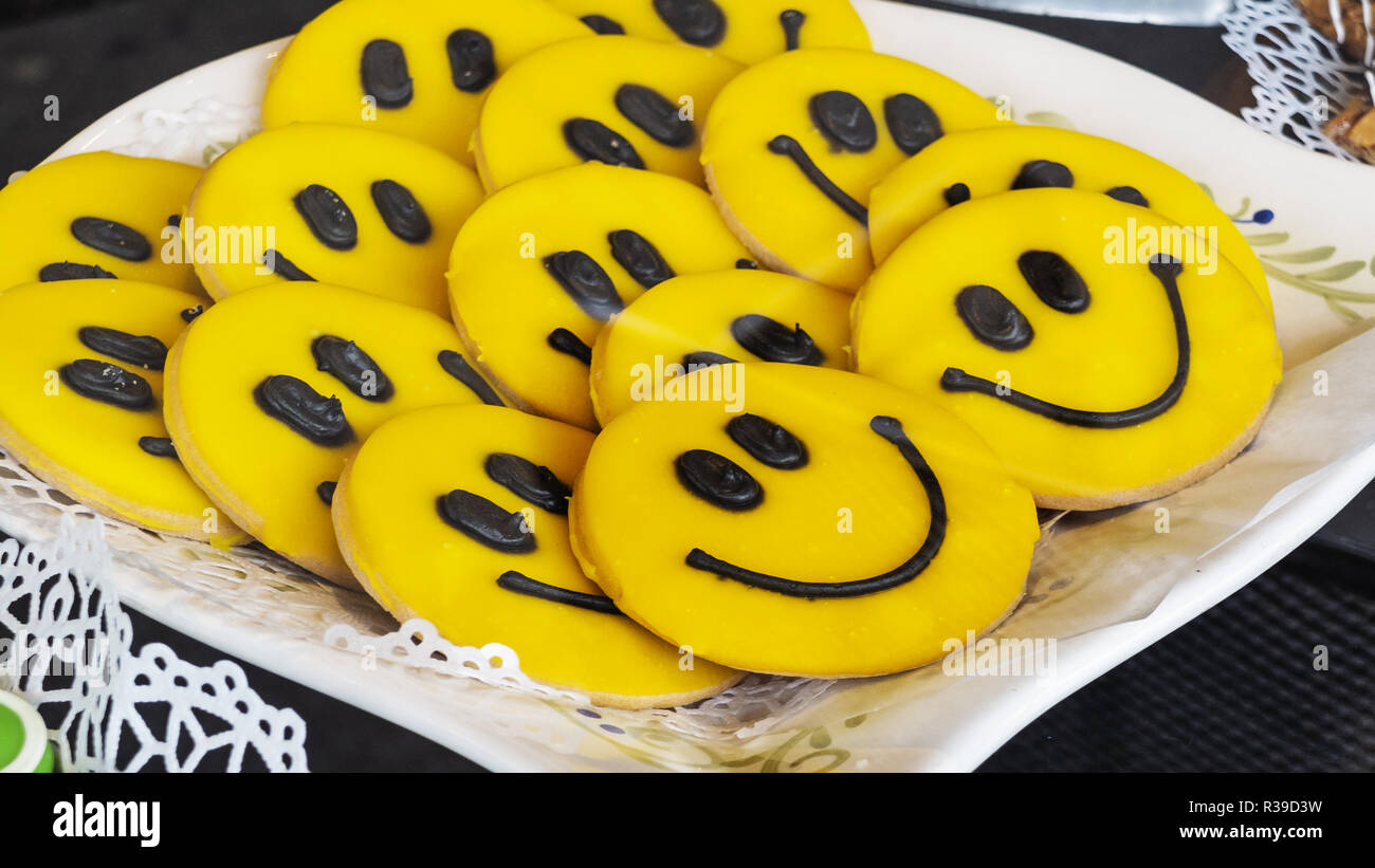 Smiley face cookie yellow hi-res stock photography and images - Alamy