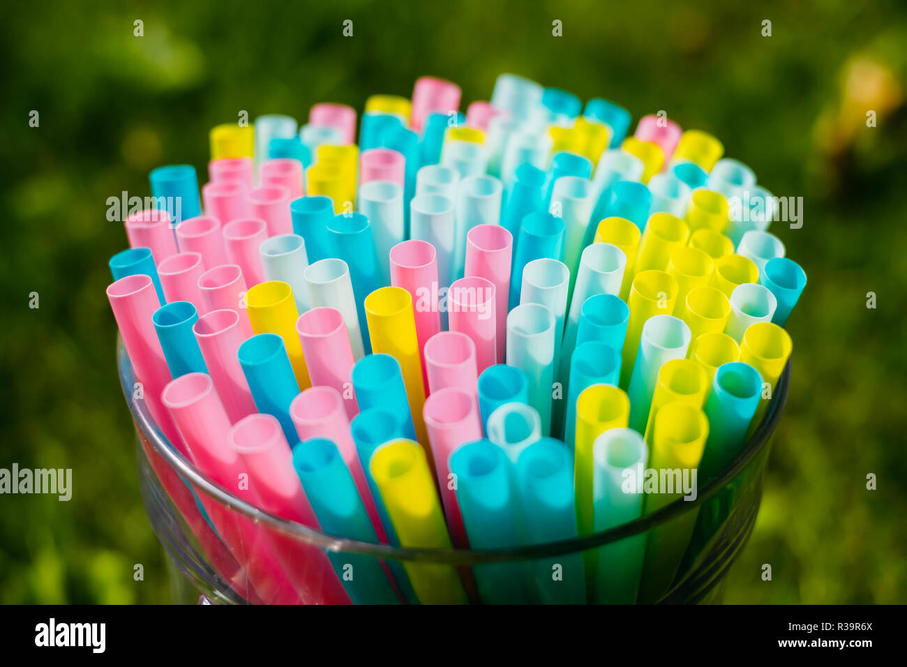 Bright colorful cocktail beverage straws and tubes put together in the ...