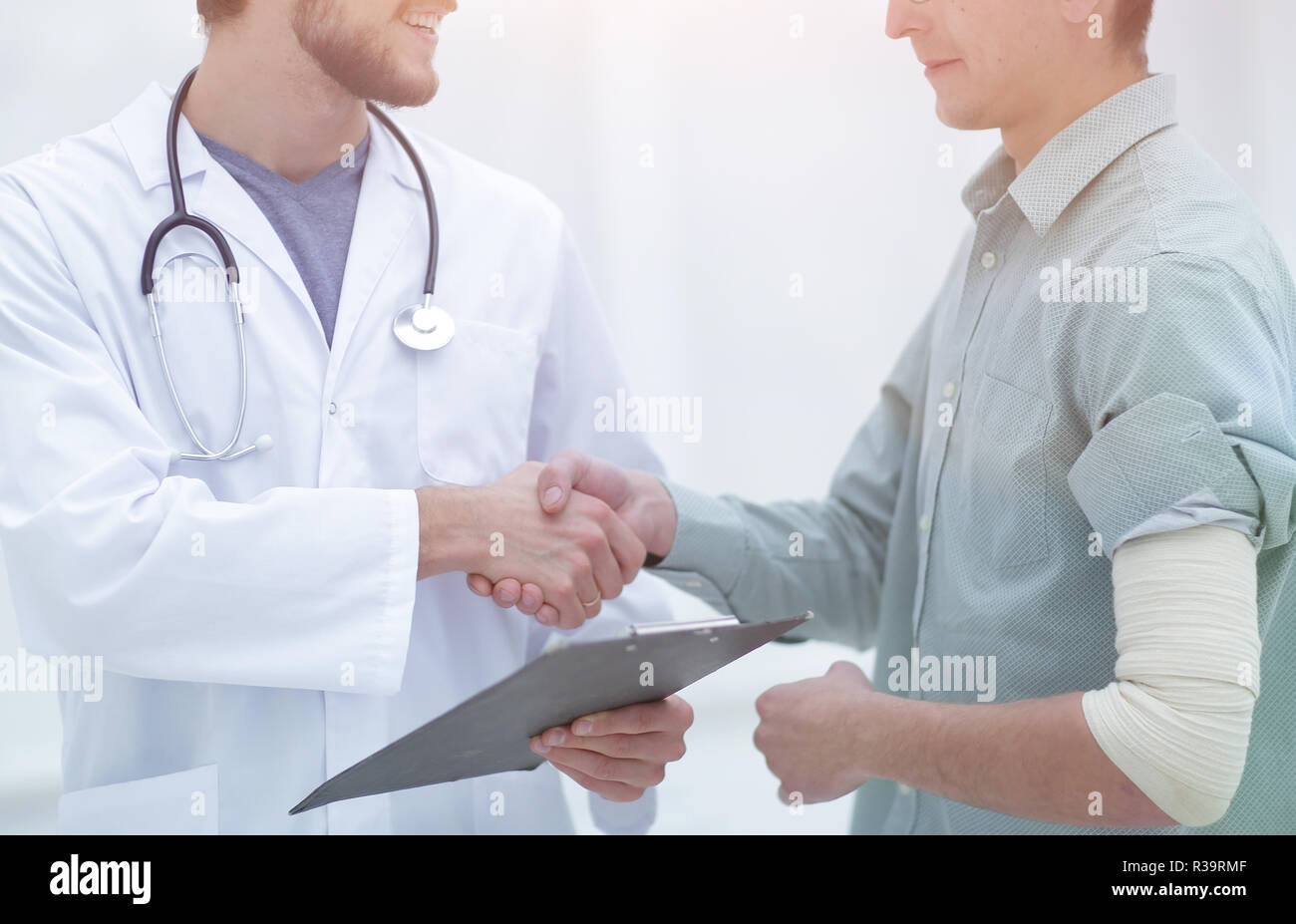 Doctor congratulating patient recovery hi-res stock photography and ...