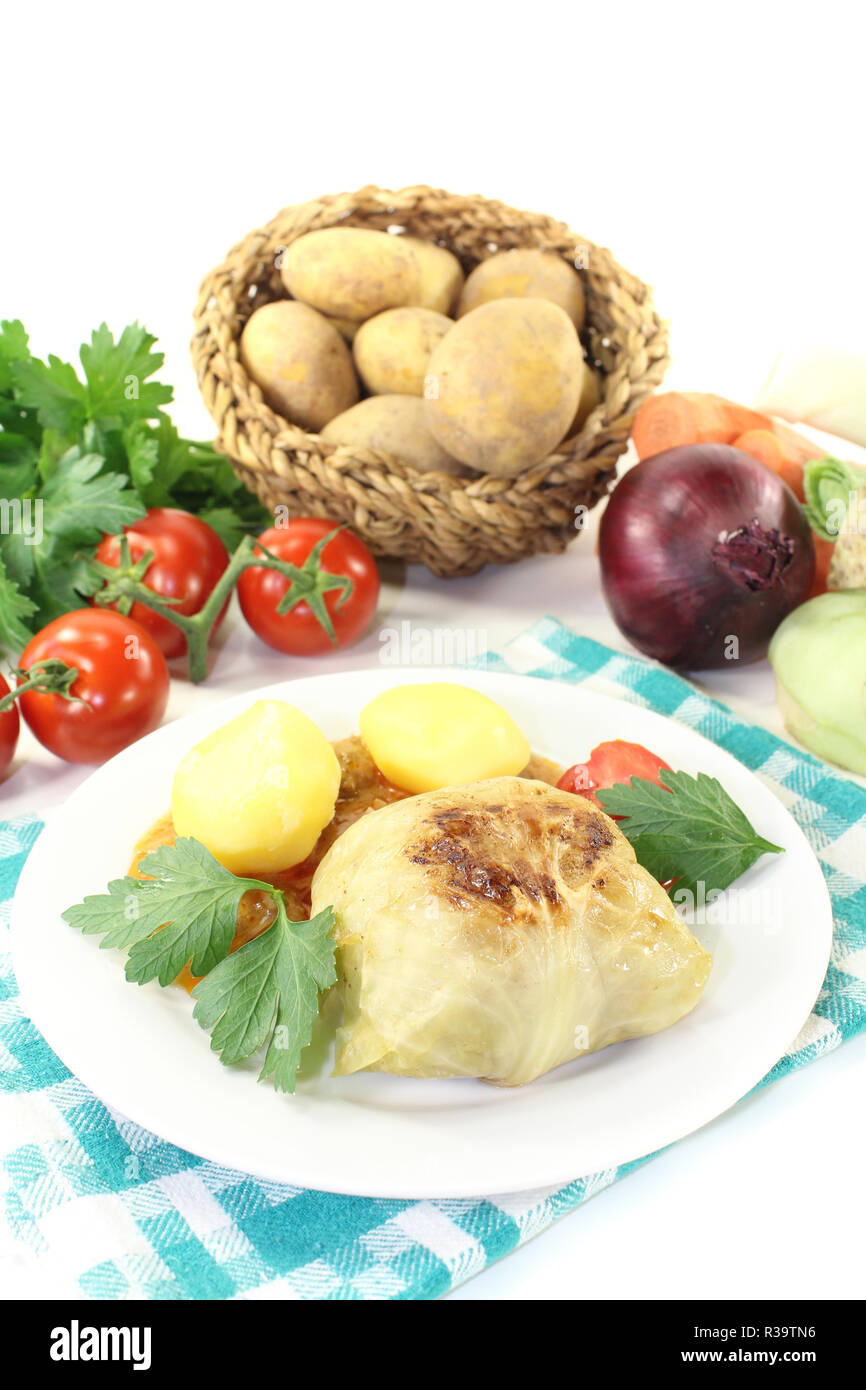 cabbage roulade with potatoes and tomato Stock Photo - Alamy