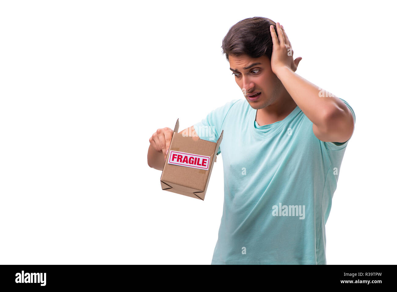 Young handsome man with fragile box ordered from Internet Stock Photo ...