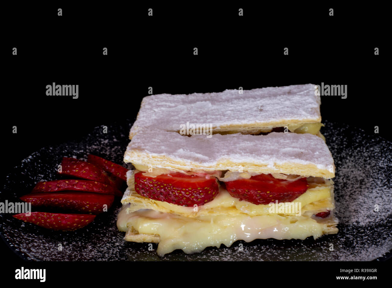 French Mille-feuille cake with fresh strawberry with isolated black ...