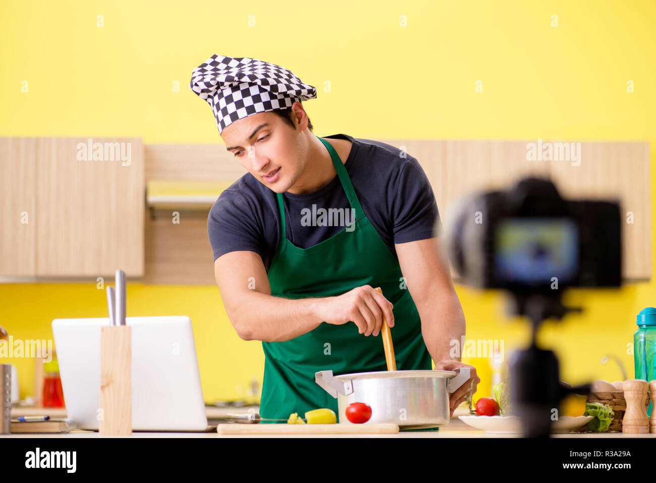 Young chef blogger explaining food preparation Stock Photo - Alamy
