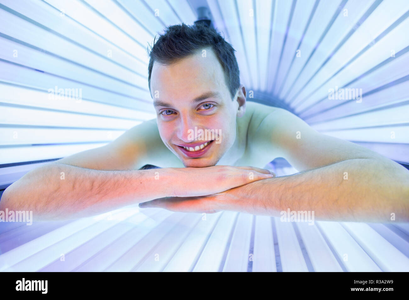 Man, tanning salon hi-res stock photography and images - Alamy