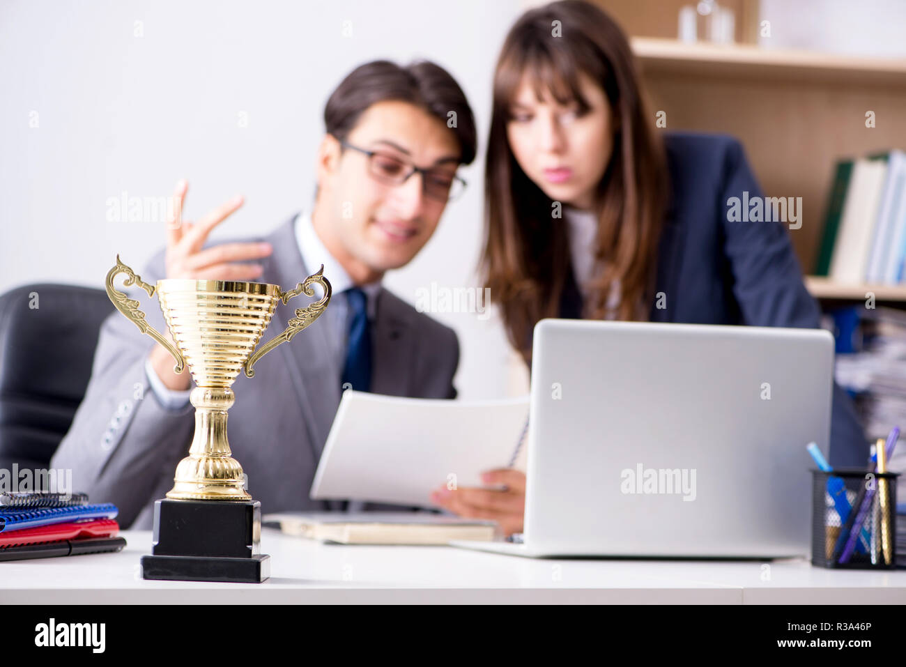 Concept of teamwork with prize Stock Photo - Alamy
