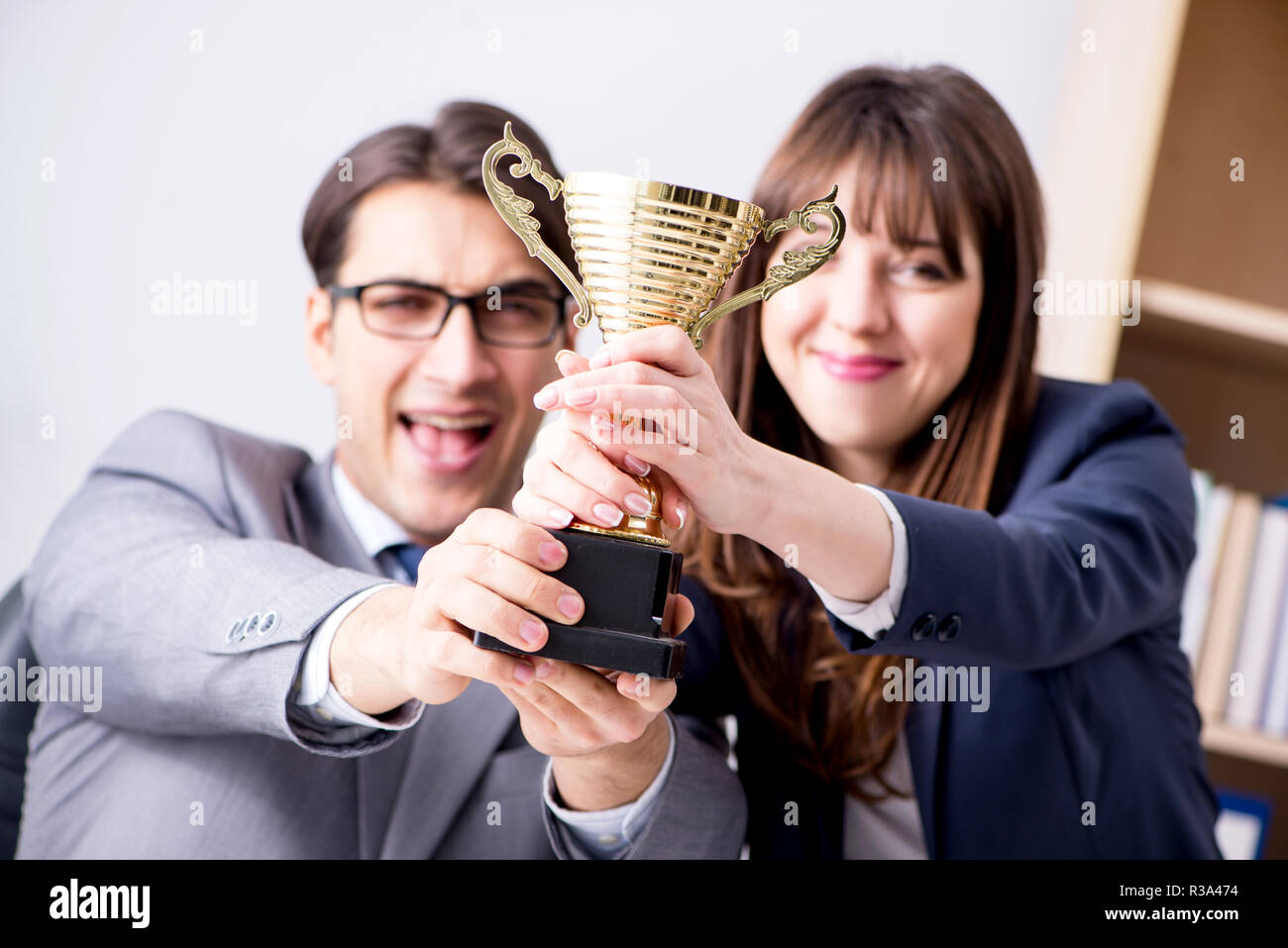 Concept of teamwork with prize Stock Photo - Alamy