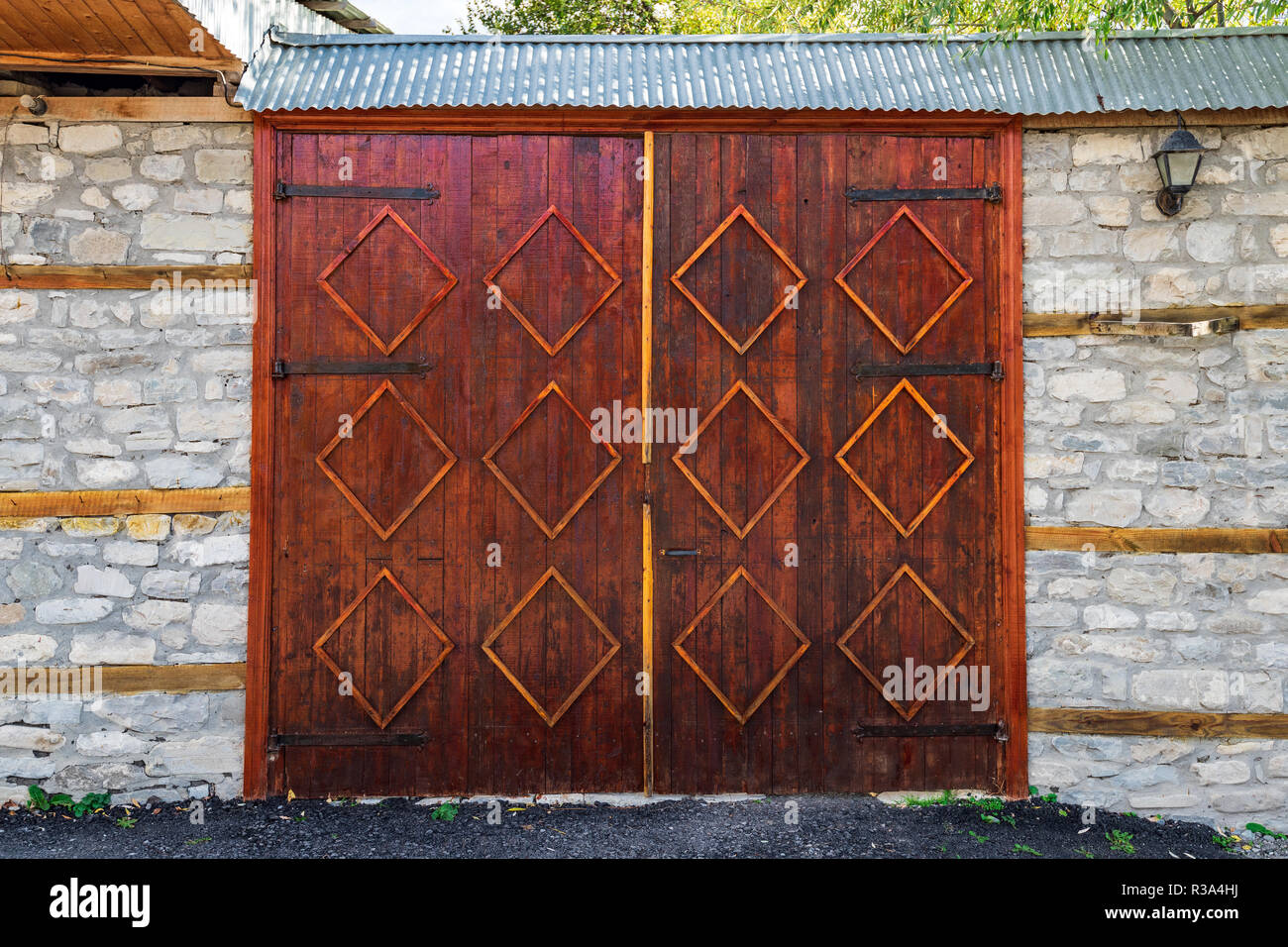 Old wooden gate in the stone wall Stock Photo - Alamy