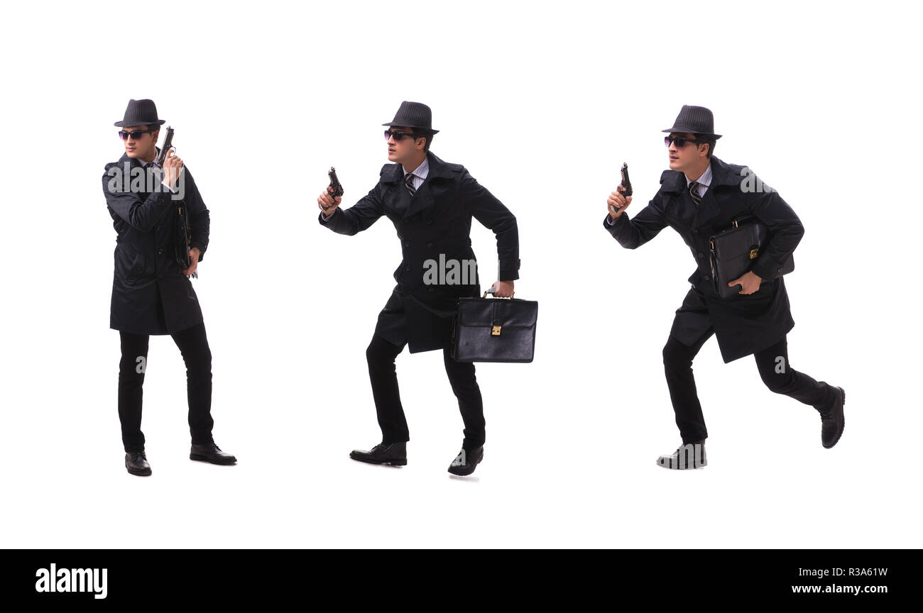 Man spy with handgun isolated on white background Stock Photo - Alamy