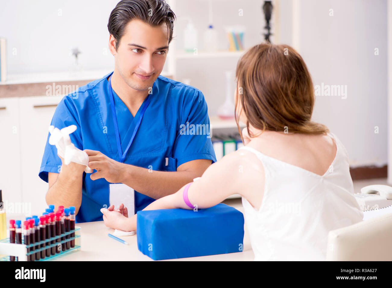 Young patient during blood test sampling procedure Stock Photo - Alamy