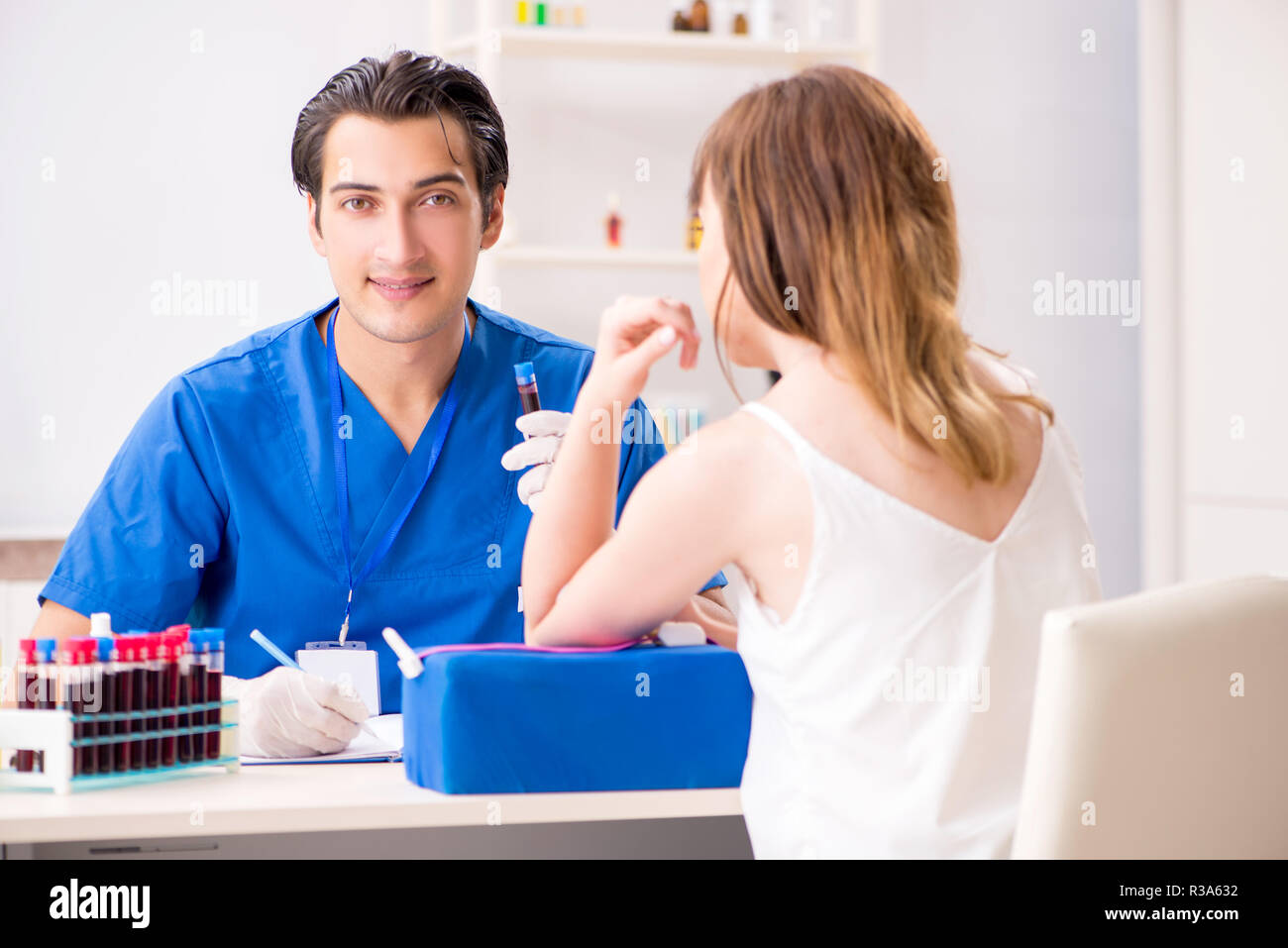 Young patient during blood test sampling procedure Stock Photo - Alamy