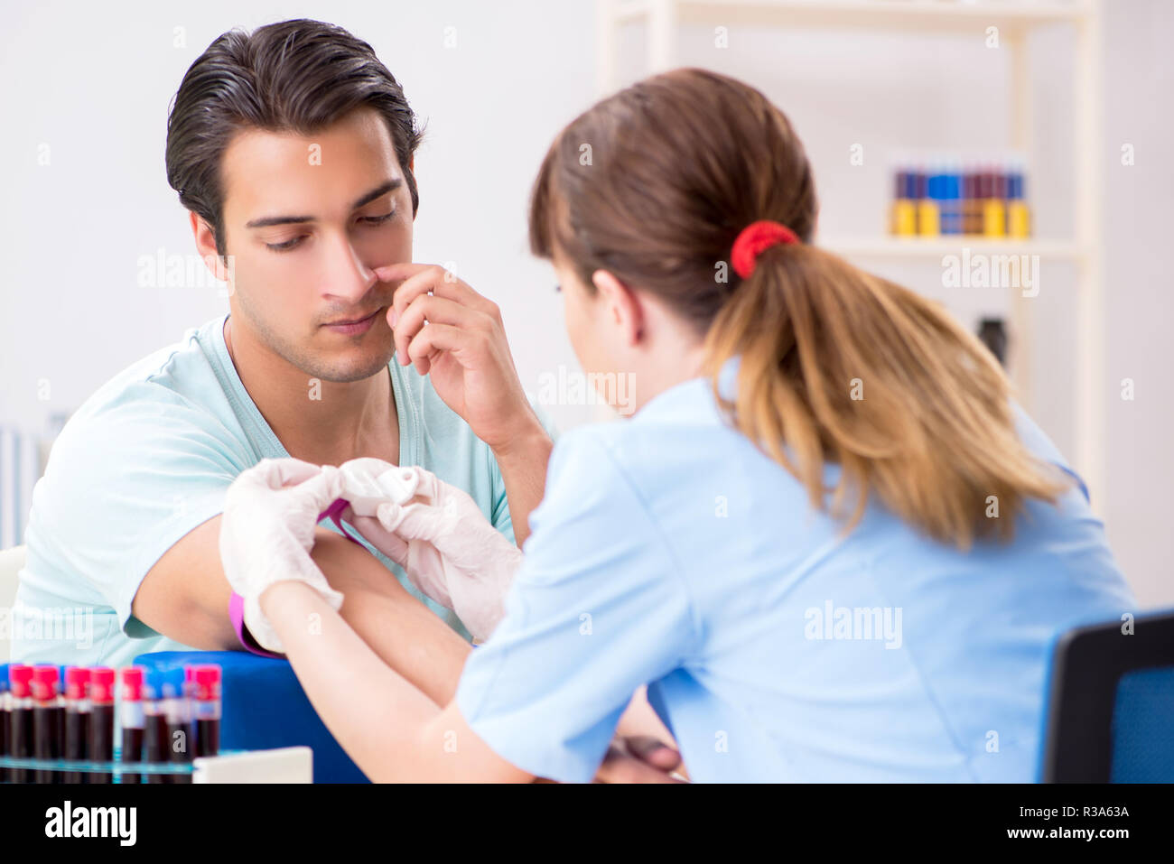 Young patient during blood test sampling procedure Stock Photo - Alamy