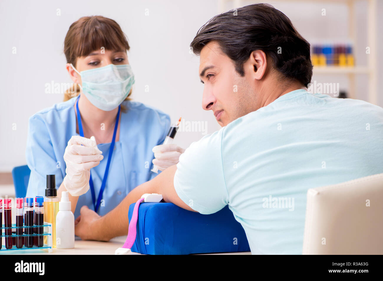 Young patient during blood test sampling procedure Stock Photo - Alamy