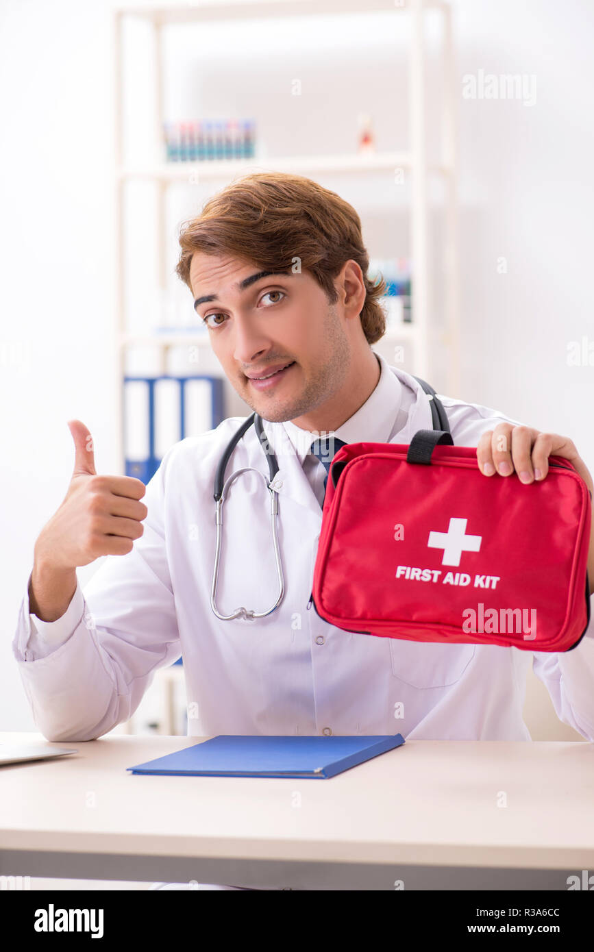 Young doctor with first aid kit in hospital Stock Photo - Alamy