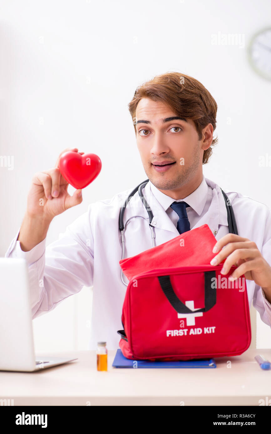 Young doctor with first aid kit in hospital Stock Photo - Alamy