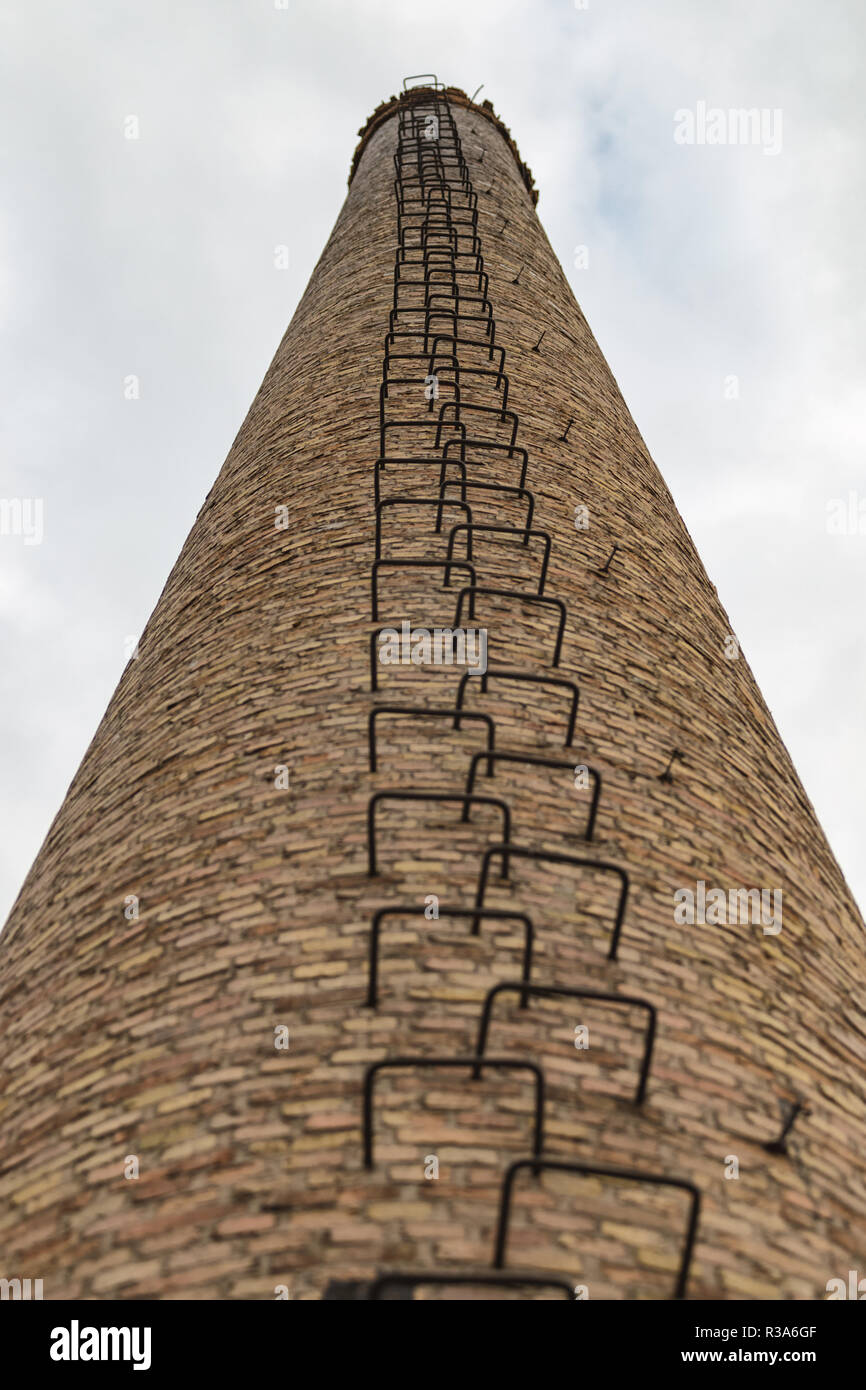 old round brick tower with metal steps up Stock Photo - Alamy