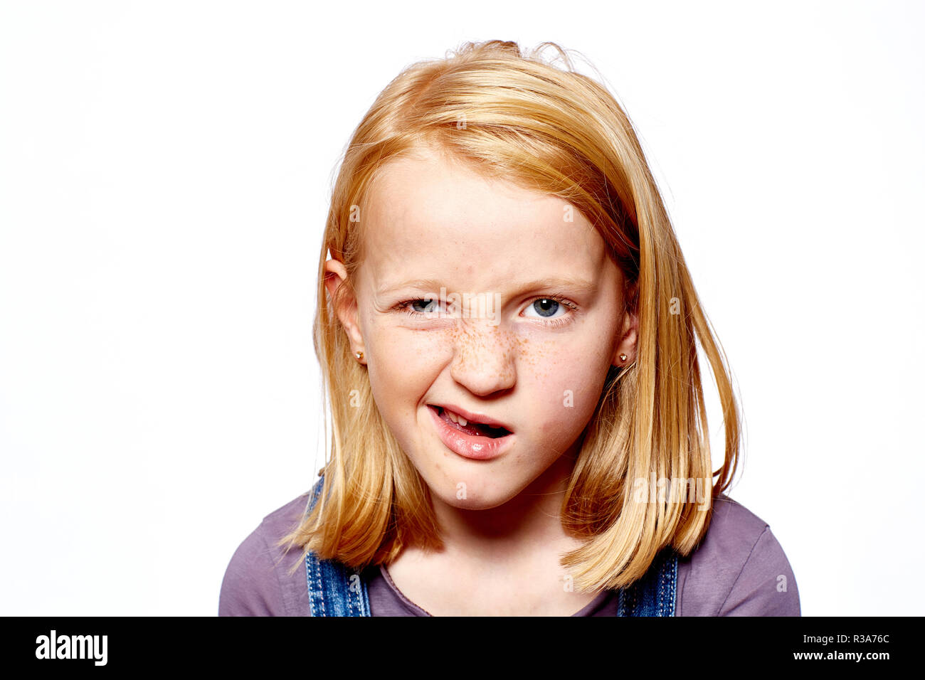 girl looks cheeky Stock Photo - Alamy