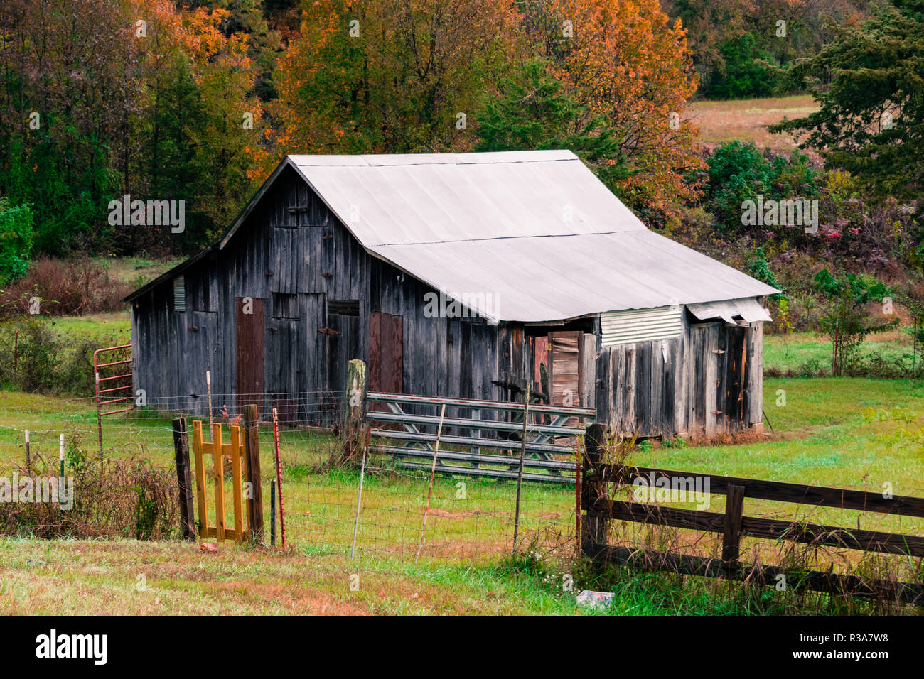 Old weathered wooden barn on a hillside in the Ozark Mountains of ...