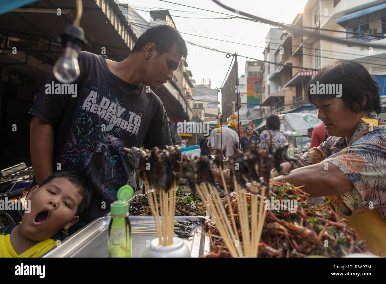 A lady seen selling bugs and insects in Chinatown, Bangkok, Thailand ...