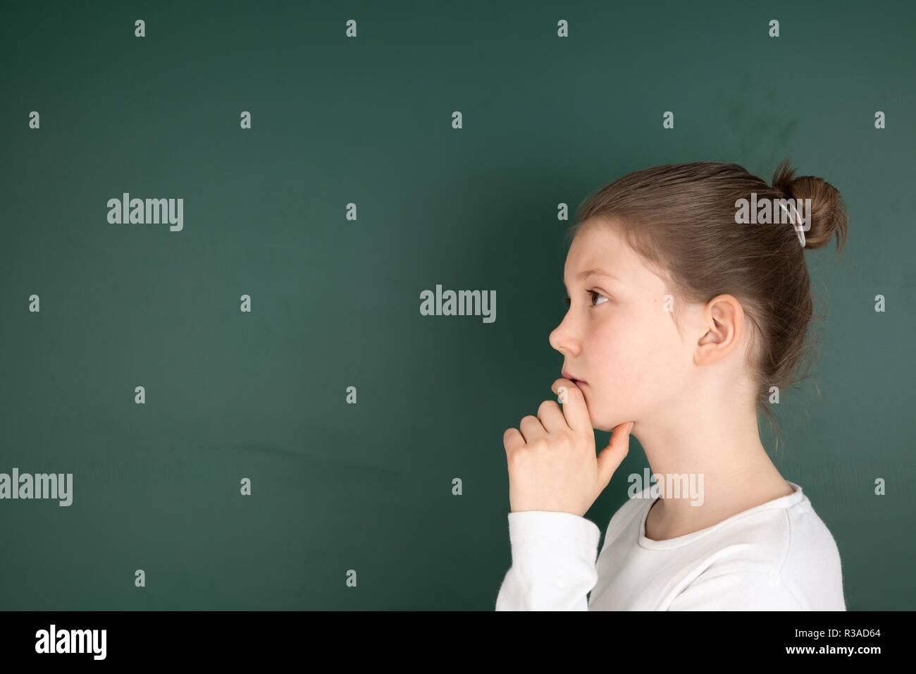 student at blackboard while thinking Stock Photo - Alamy