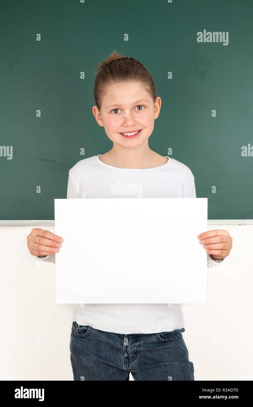 schoolgirl holding a white sign Stock Photo - Alamy