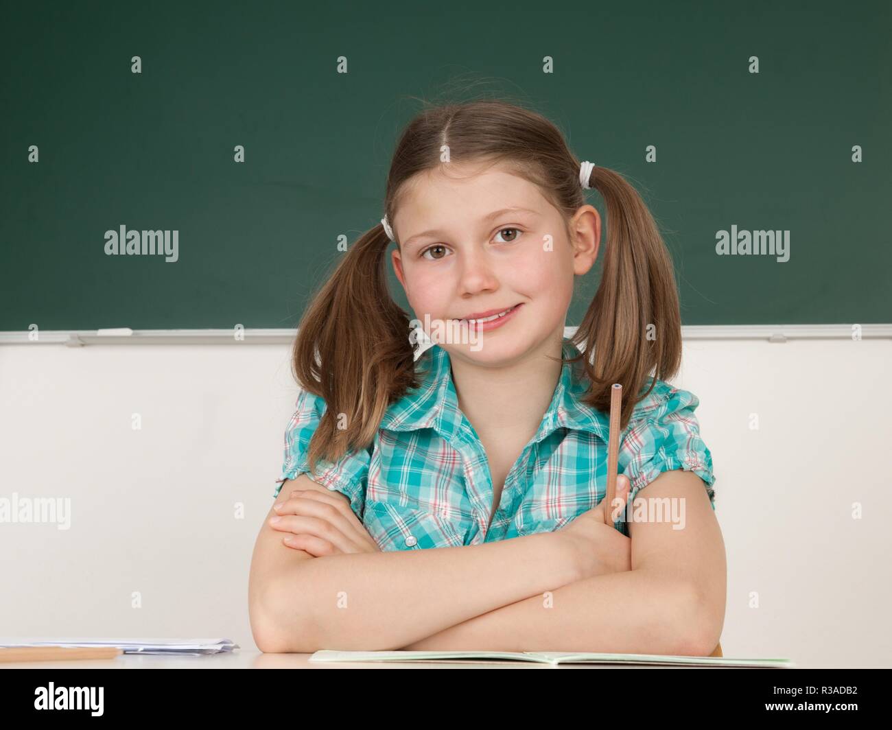 Sitting schoolgirl smiling education face to face hi-res stock ...