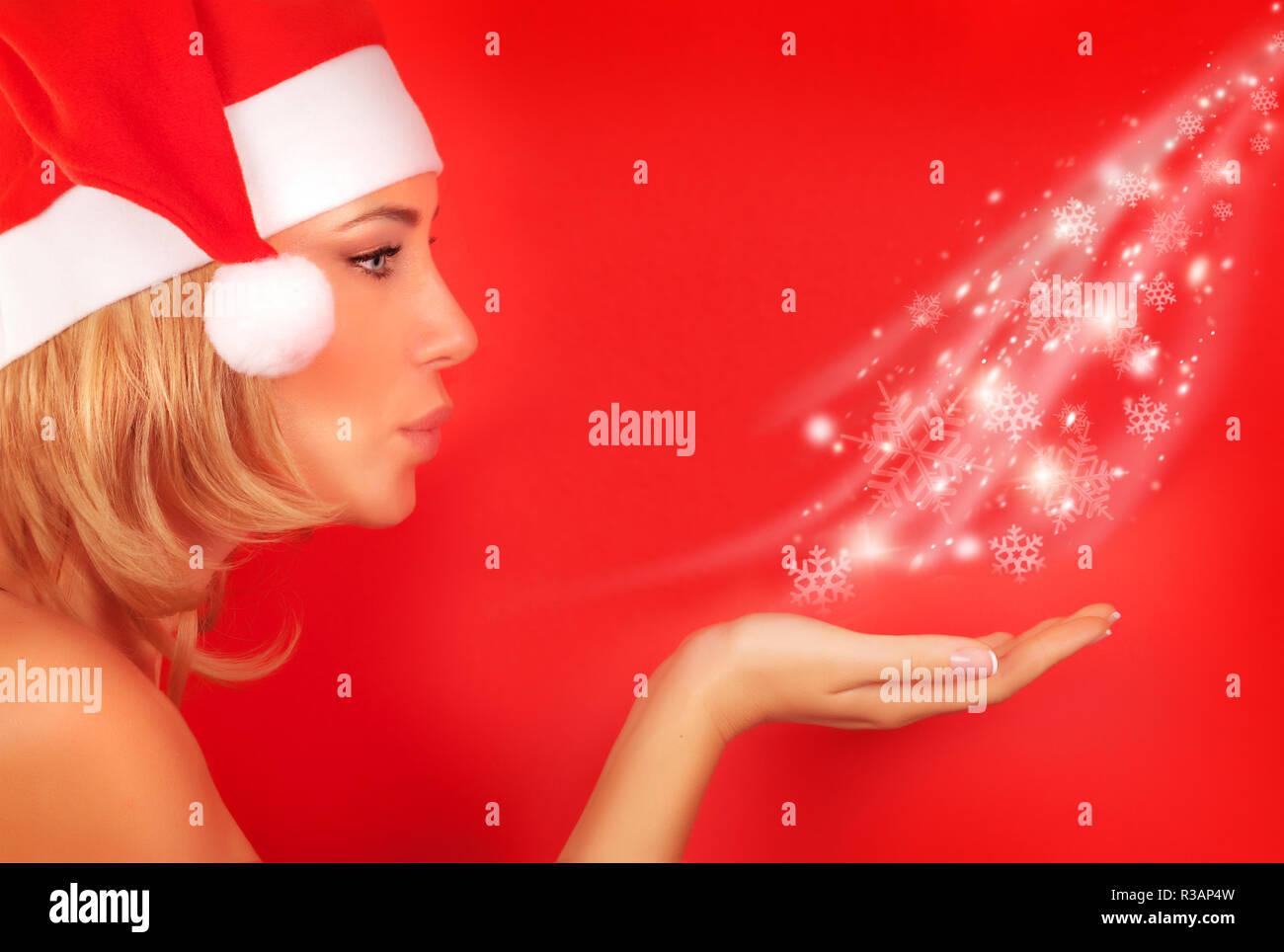 Young woman blowing kiss side hi-res stock photography and images - Alamy