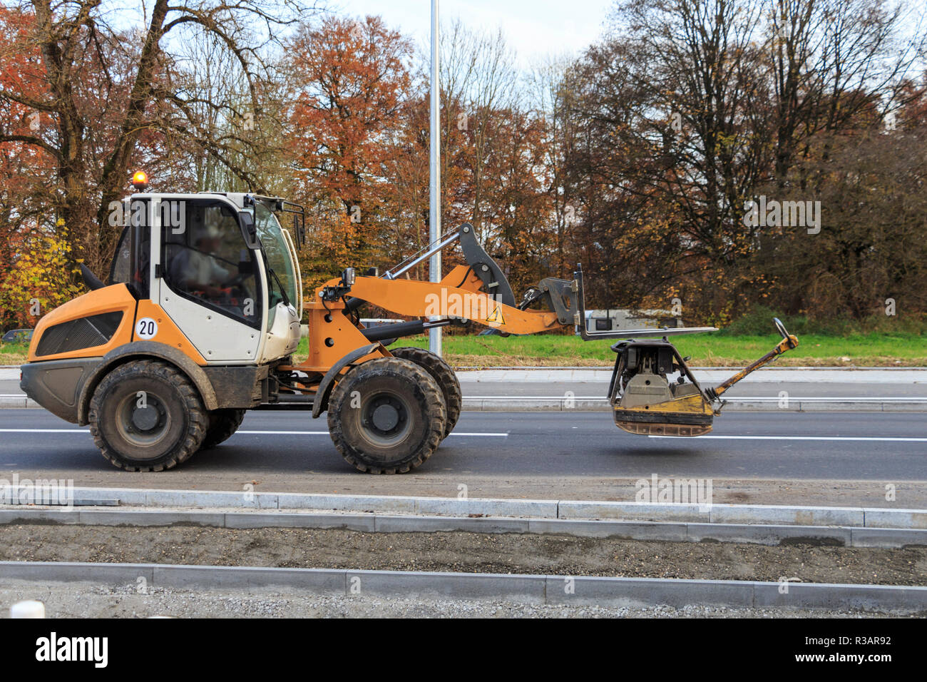 construction vehicle carries a construction equipment Stock Photo - Alamy