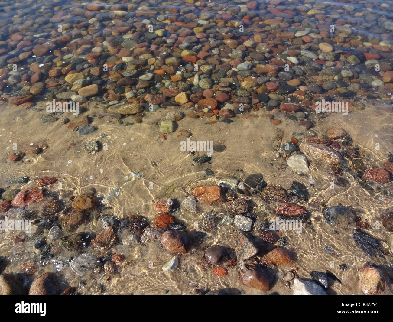 pebbles in the water Stock Photo - Alamy