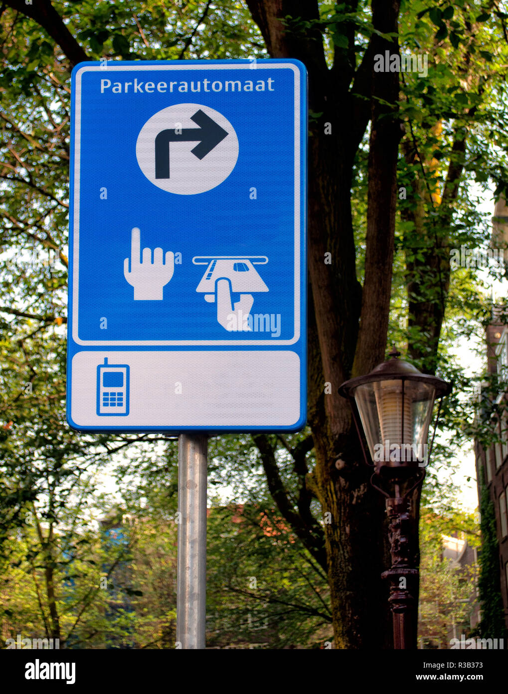 Automatic parking blue sign in Amsterdam, Netherlands Stock Photo - Alamy