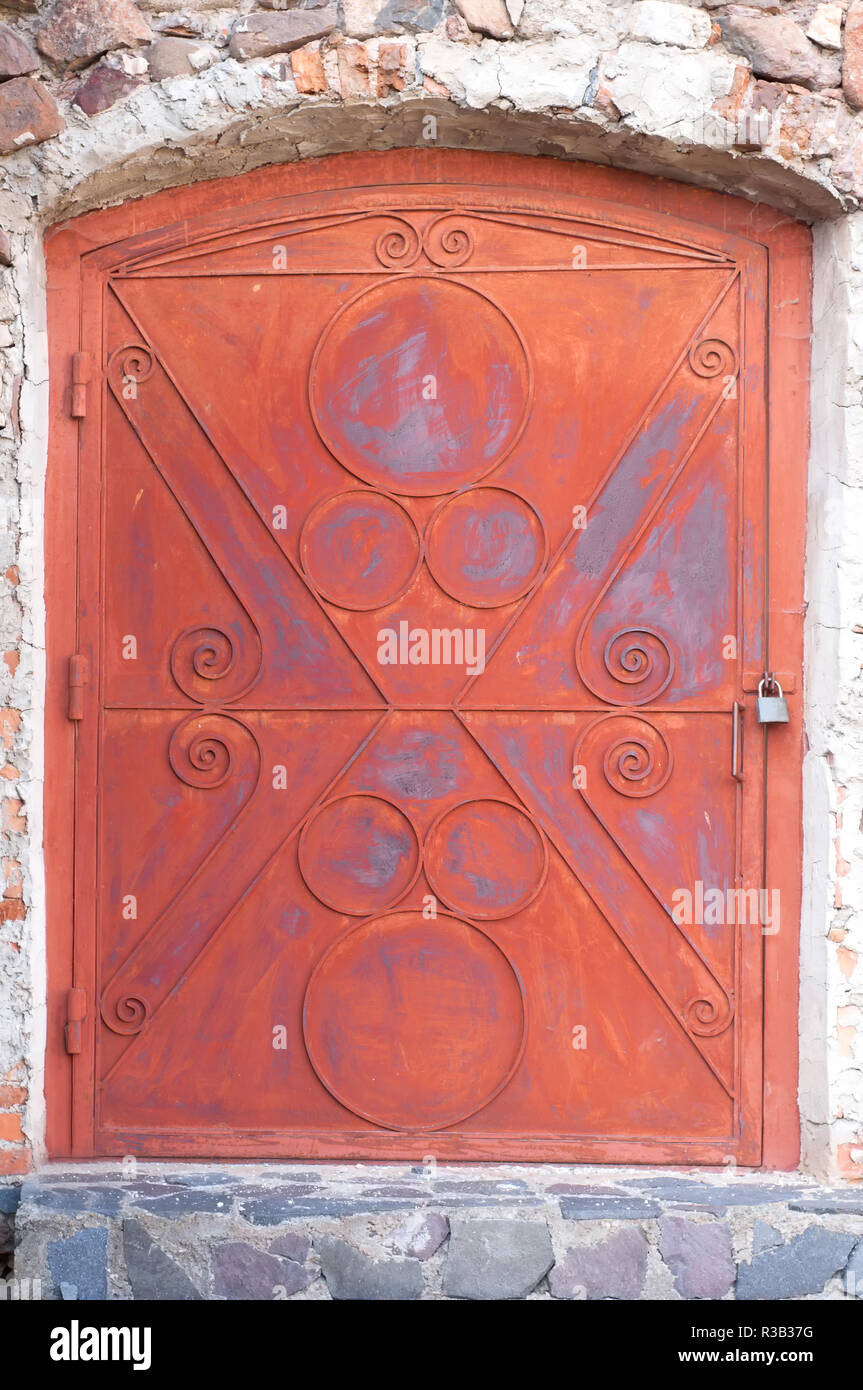 Red small door with a small lock Stock Photo - Alamy