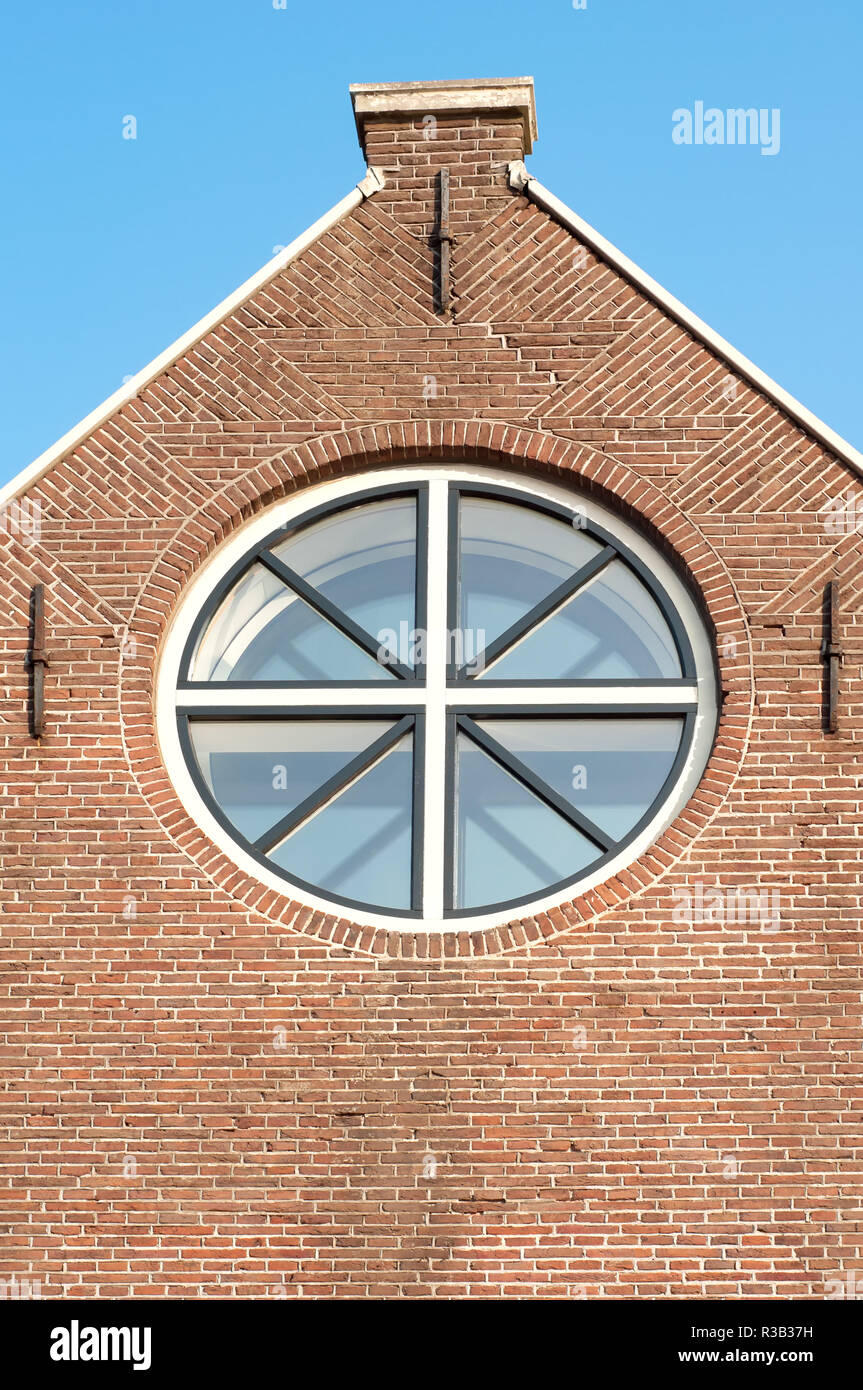 Brick wall with round window in Amsterdam, Netherlands Stock Photo - Alamy