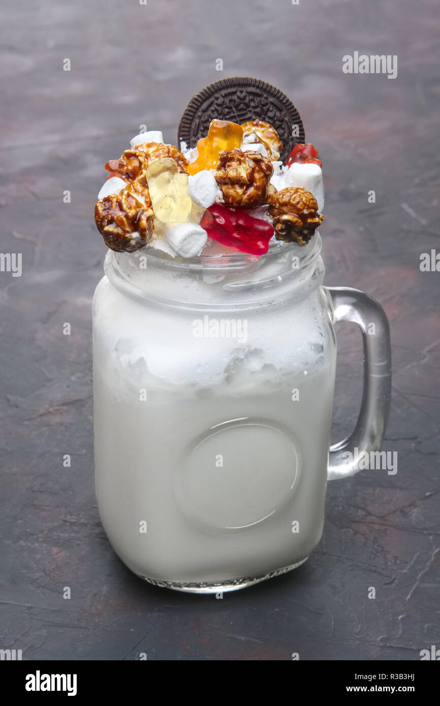 Cocktail for kids - milkshake drink with multicolored chewing marmalade ...