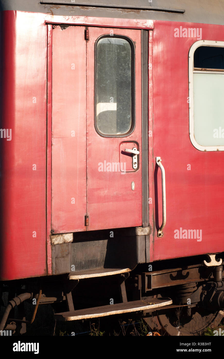 Detail of an old and red train door Stock Photo - Alamy