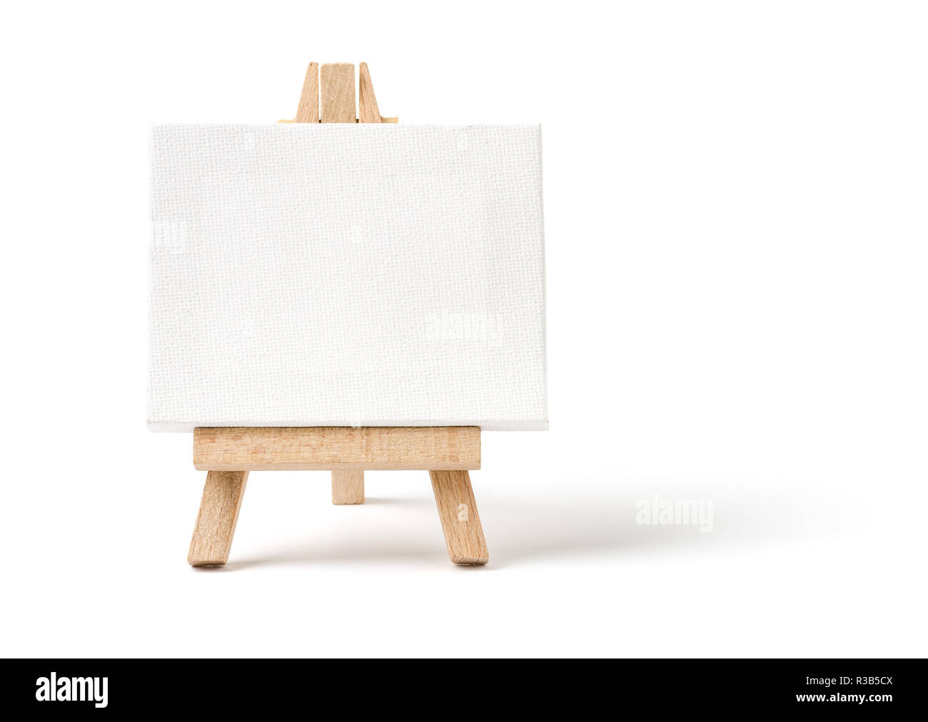 easel with empty canvas against white background Stock Photo - Alamy