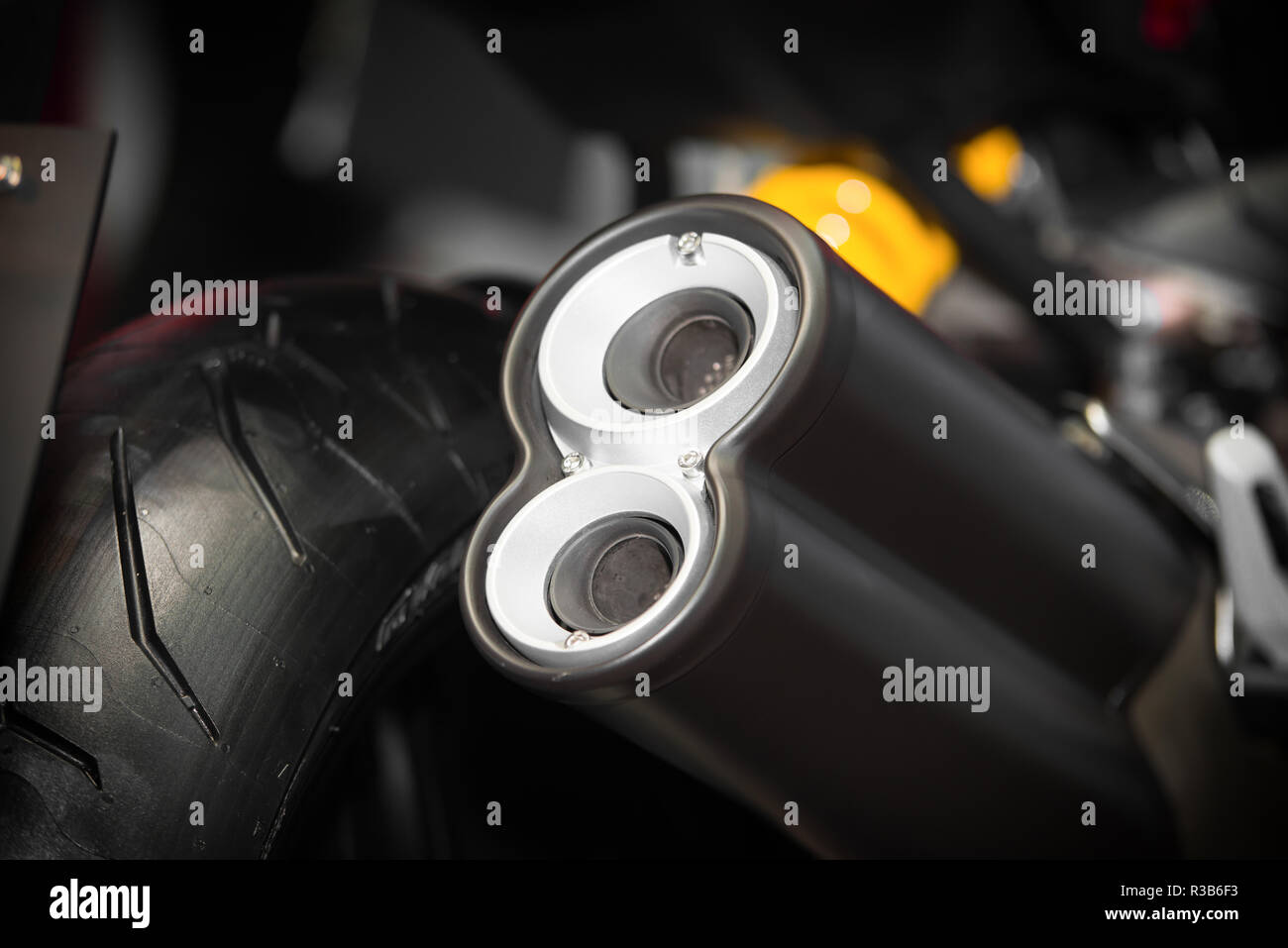 Closeup of exhaust or intake of racing motorcycle. Low angle photograph ...