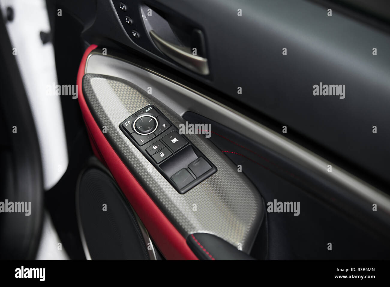 Detail on buttons controlling the windows in red car Stock Photo - Alamy