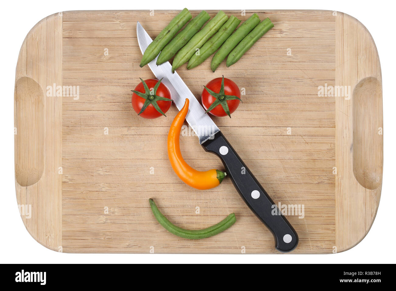 preparing and cooking face made of vegetables on chopping board food ...