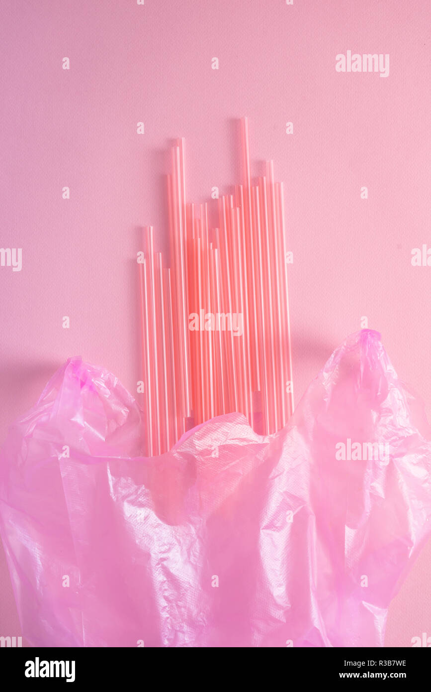 Closeup of colorful plastic waste in a pink garbage bag as recyclable ...