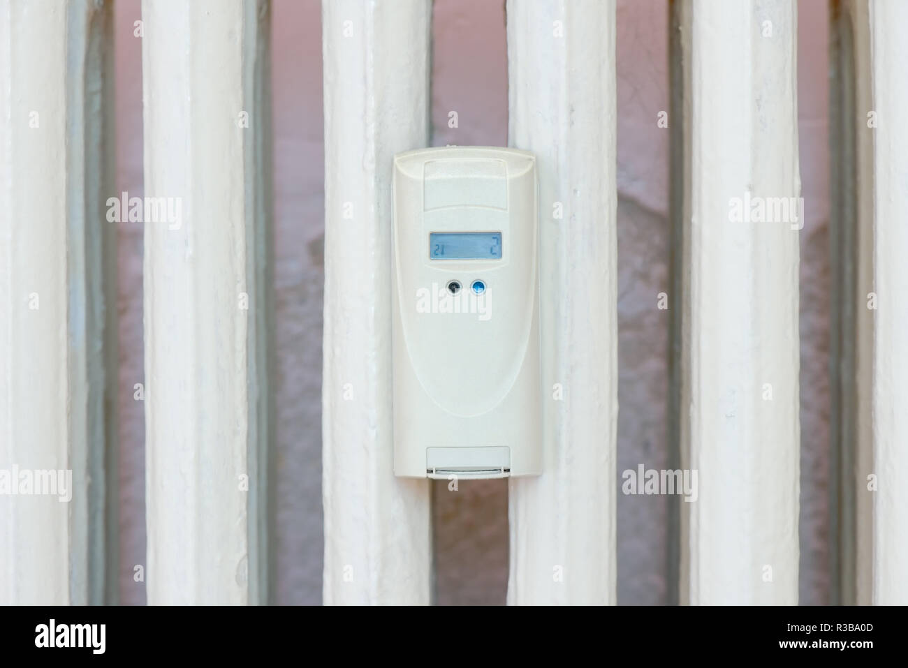 Detail of vintage white radiator with thermostat Stock Photo - Alamy