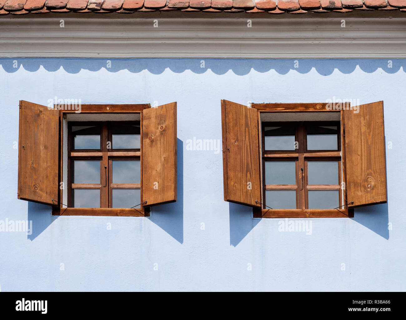 Two rustic wood windows in Viscri, Romania Stock Photo - Alamy