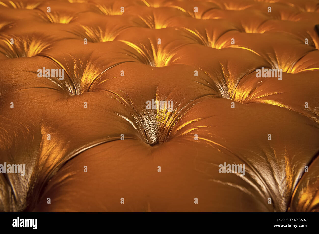 Surface of padded leather or vinyl material pattern texture on golden ...