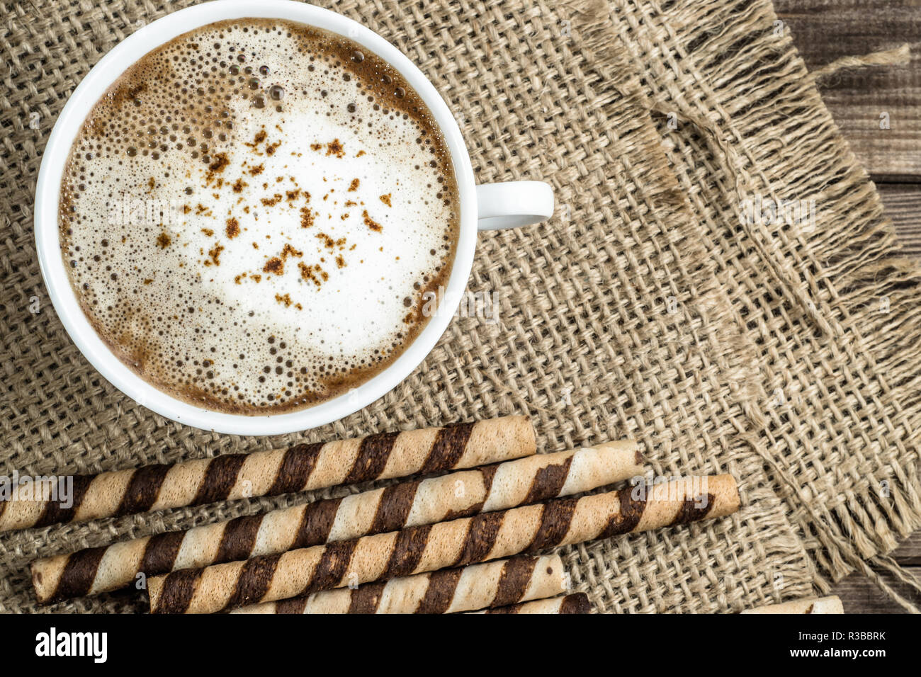 Cup of coffee and sweet snack on rustic background, from above Stock ...