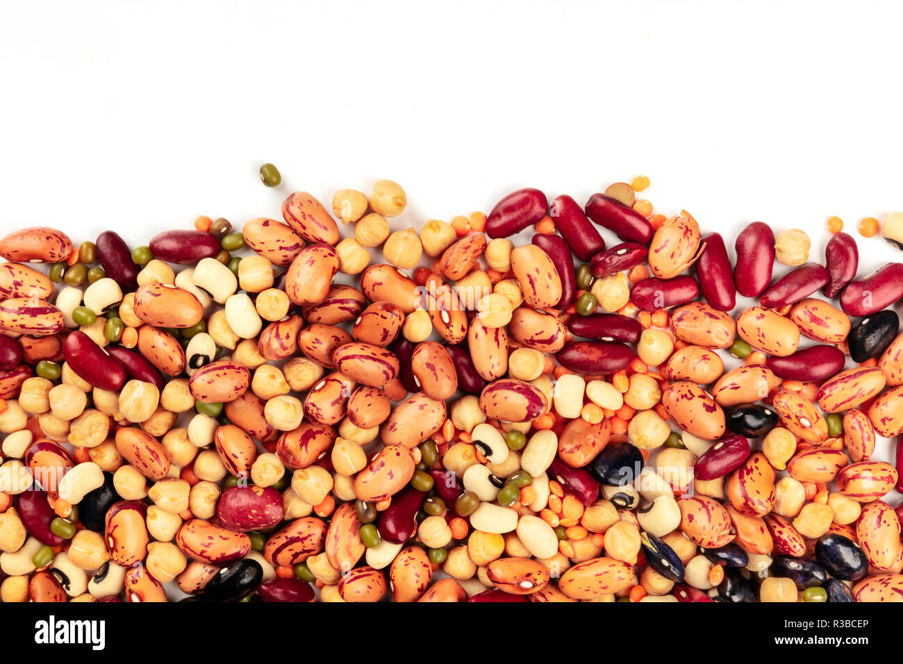 A photo of a mix of various types of legumes, shot from the top on a ...