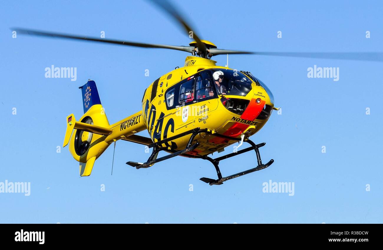 Start of a yellow ADAC medivac helicopter ( Airbus Helicopters EC 135 ...