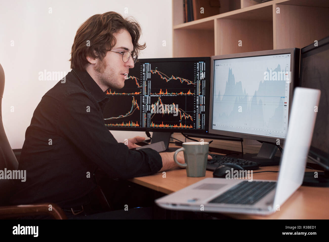 Businessmen trading stocks online. Stock broker looking at graphs ...