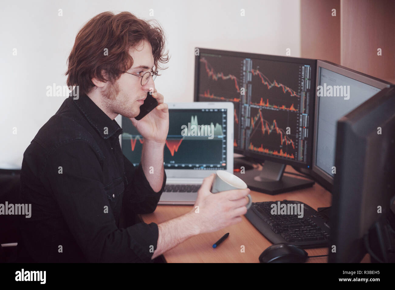 Businessman analyses graph charts hi-res stock photography and images - Alamy