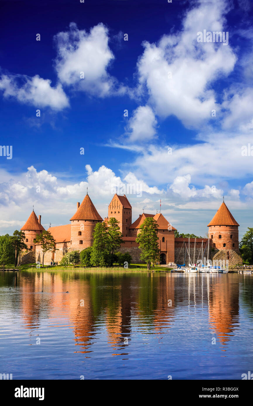 Lithuania, Vilnius. Trakai Castle reflected Galve lake in Lithuania ...