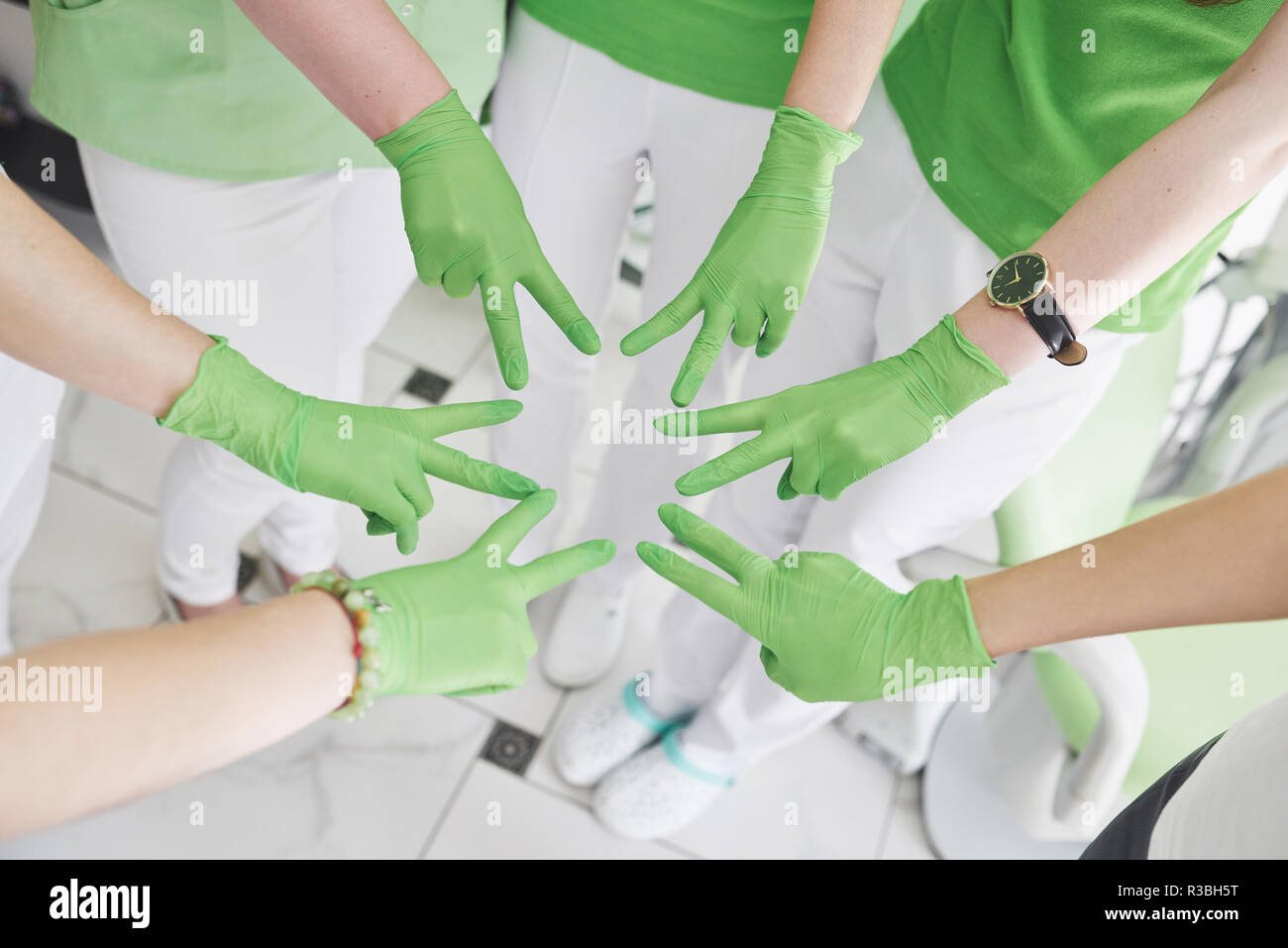Stacking their hands in a teamwork hi-res stock photography and images ...
