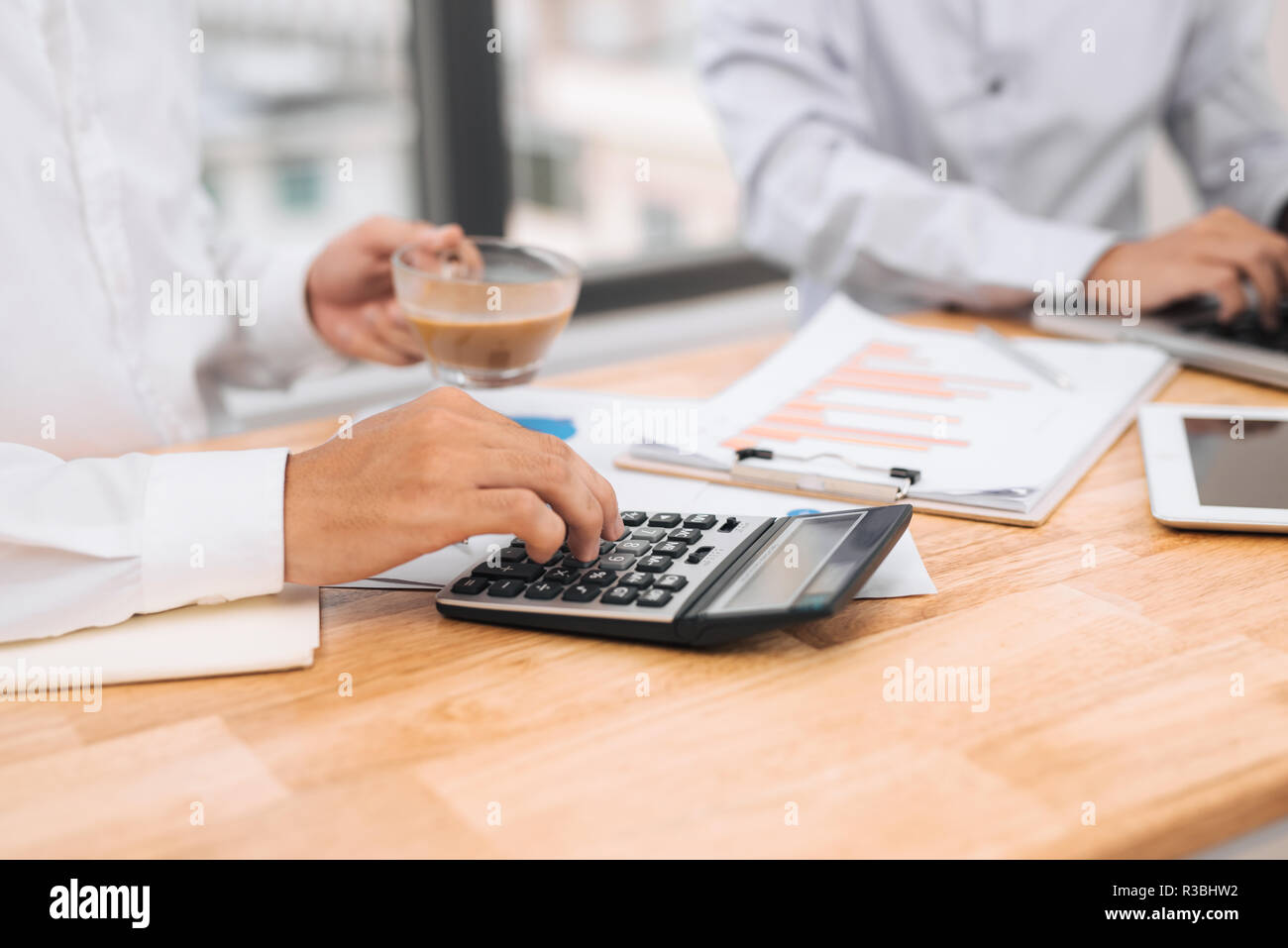Businessman on online Financial Assessment. Team work in office Stock ...